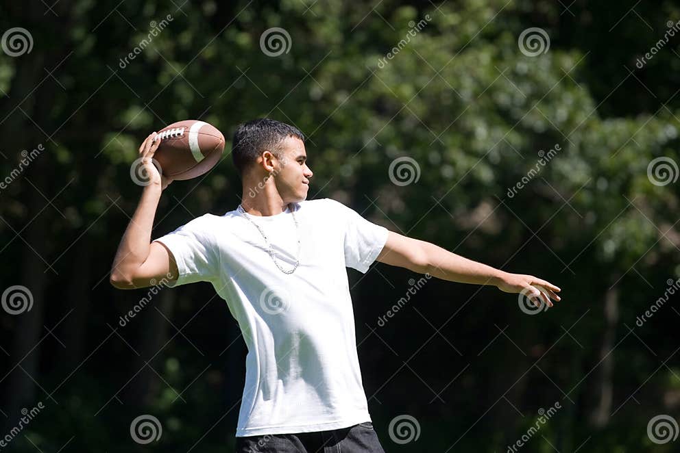 Man Throwing a Football stock image. Image of adult, american - 10769231