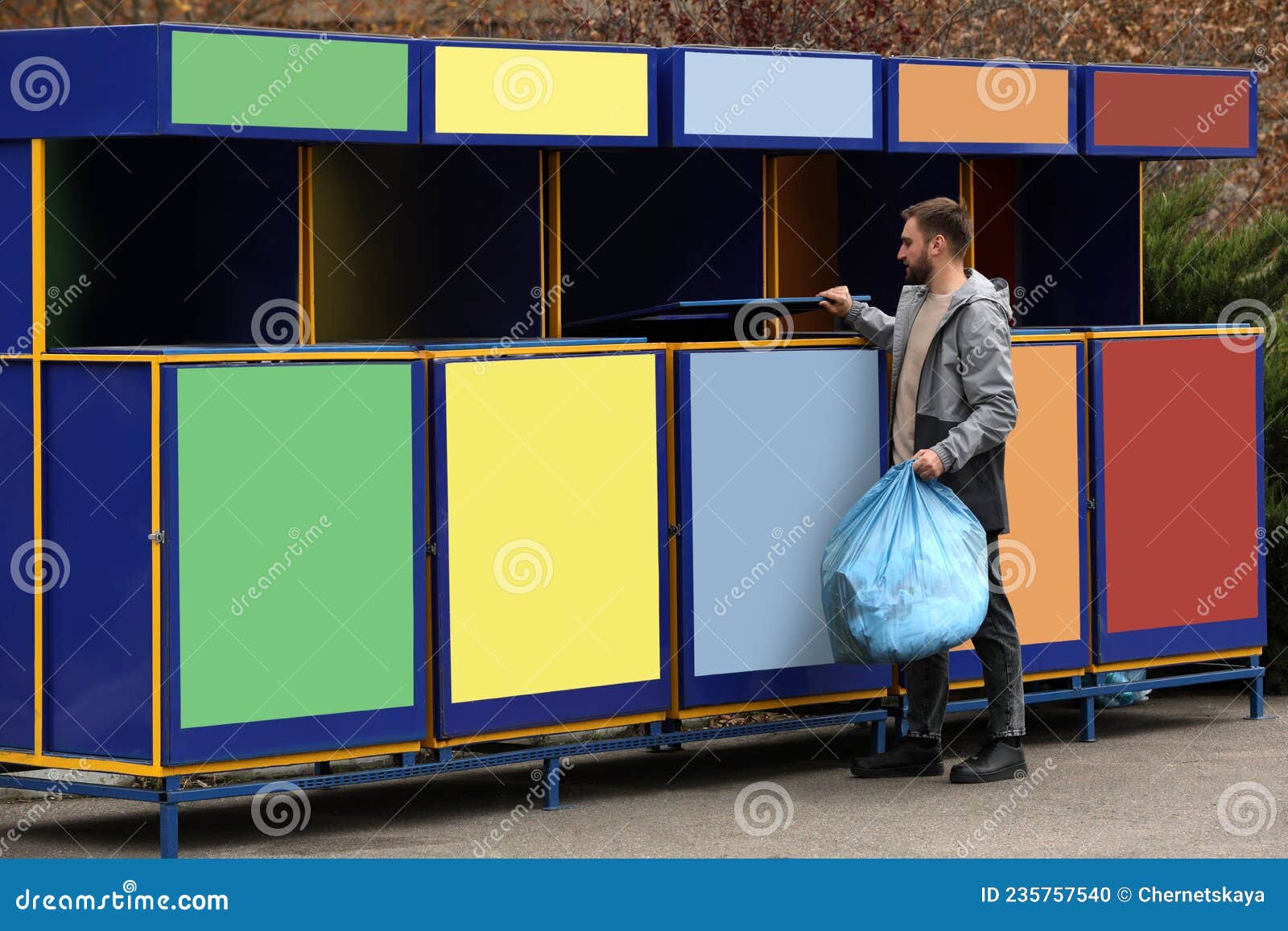 Man Throwing Garbage into Bin at Recycling Point Outdoors Stock Photo ...