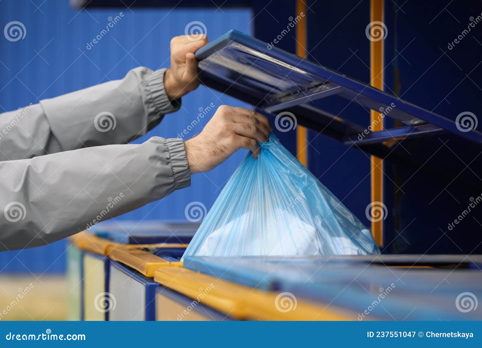 Man Throwing Garbage into Bin at Recycling Point Outdoors, Closeup ...