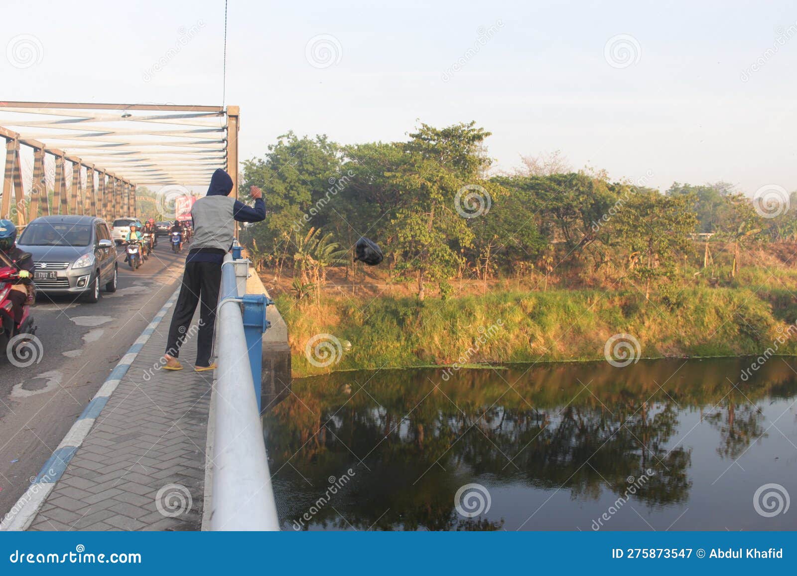 Throw garbage stock image. Image of reflection, canal - 275873547