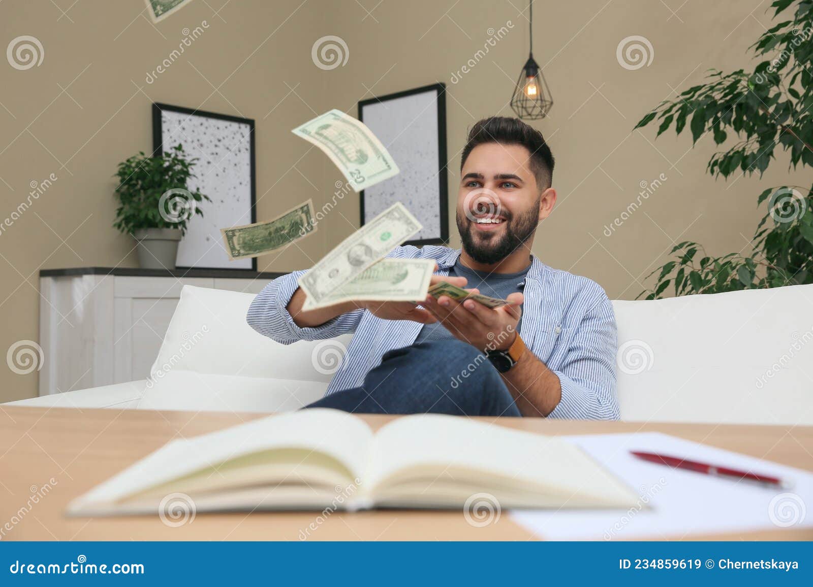 Young Man Throwing Money at Table Indoors Stock Image - Image of person ...