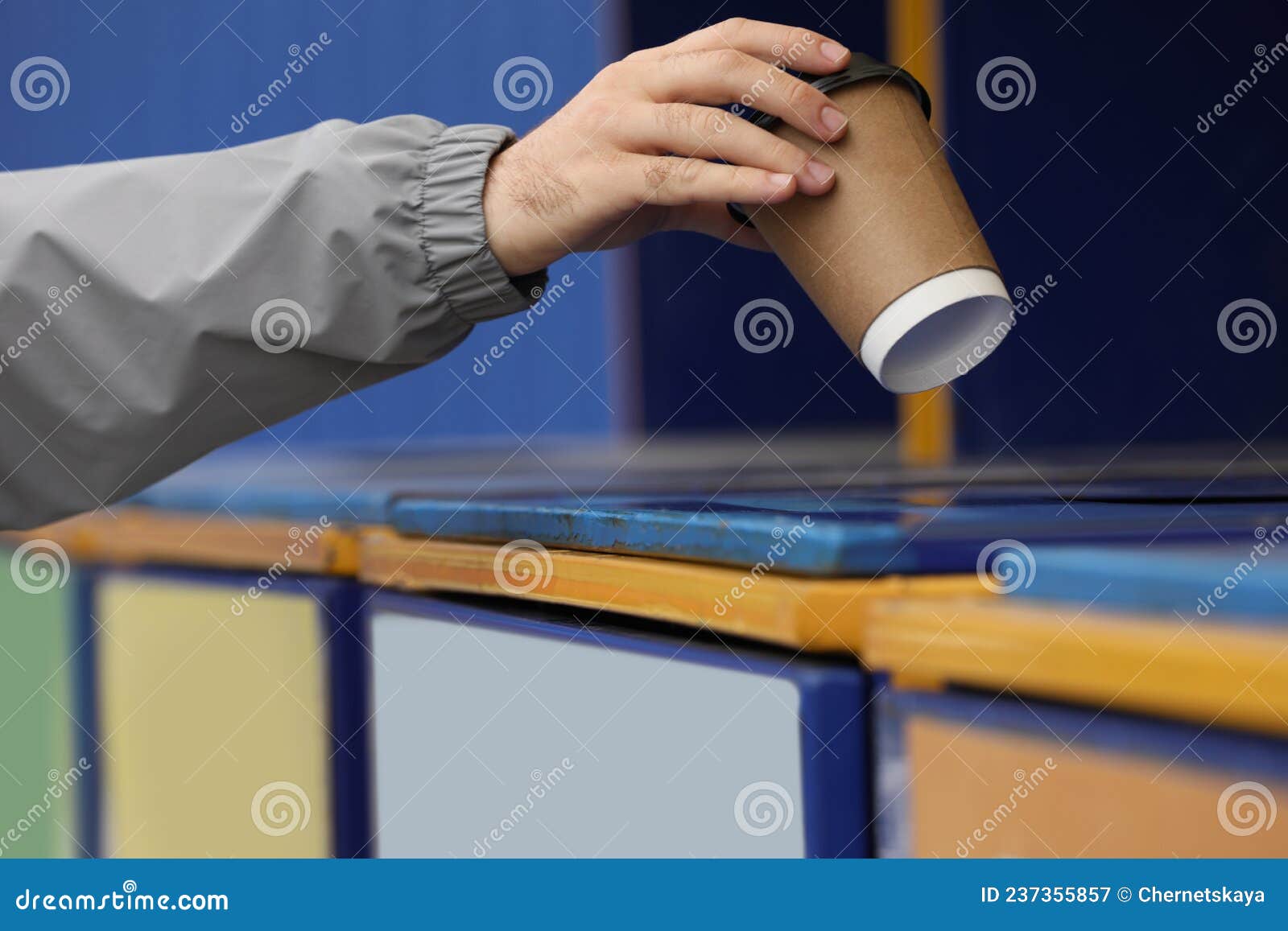 Man Throwing Paper Coffee Cup into Garbage Bin Outdoors, Closeup. Waste ...