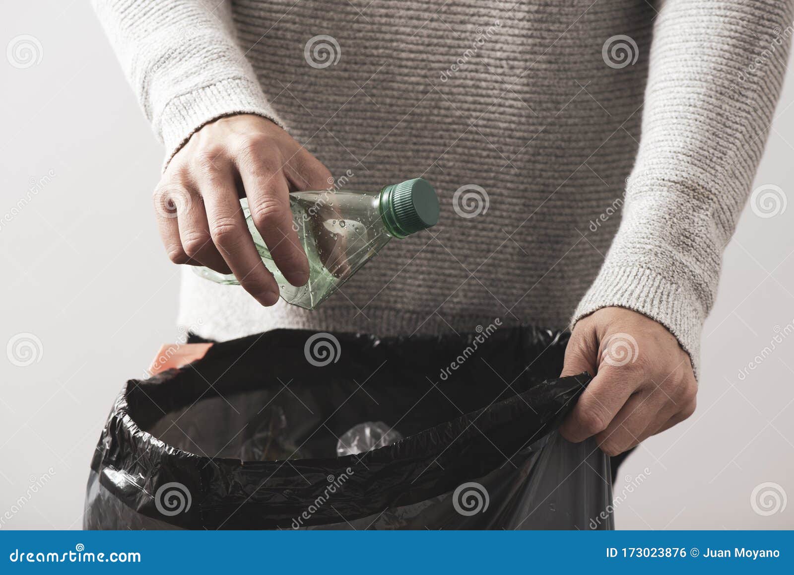 Man Throwing a Plastic Bottle To the Trash Bin Stock Photo - Image of ...