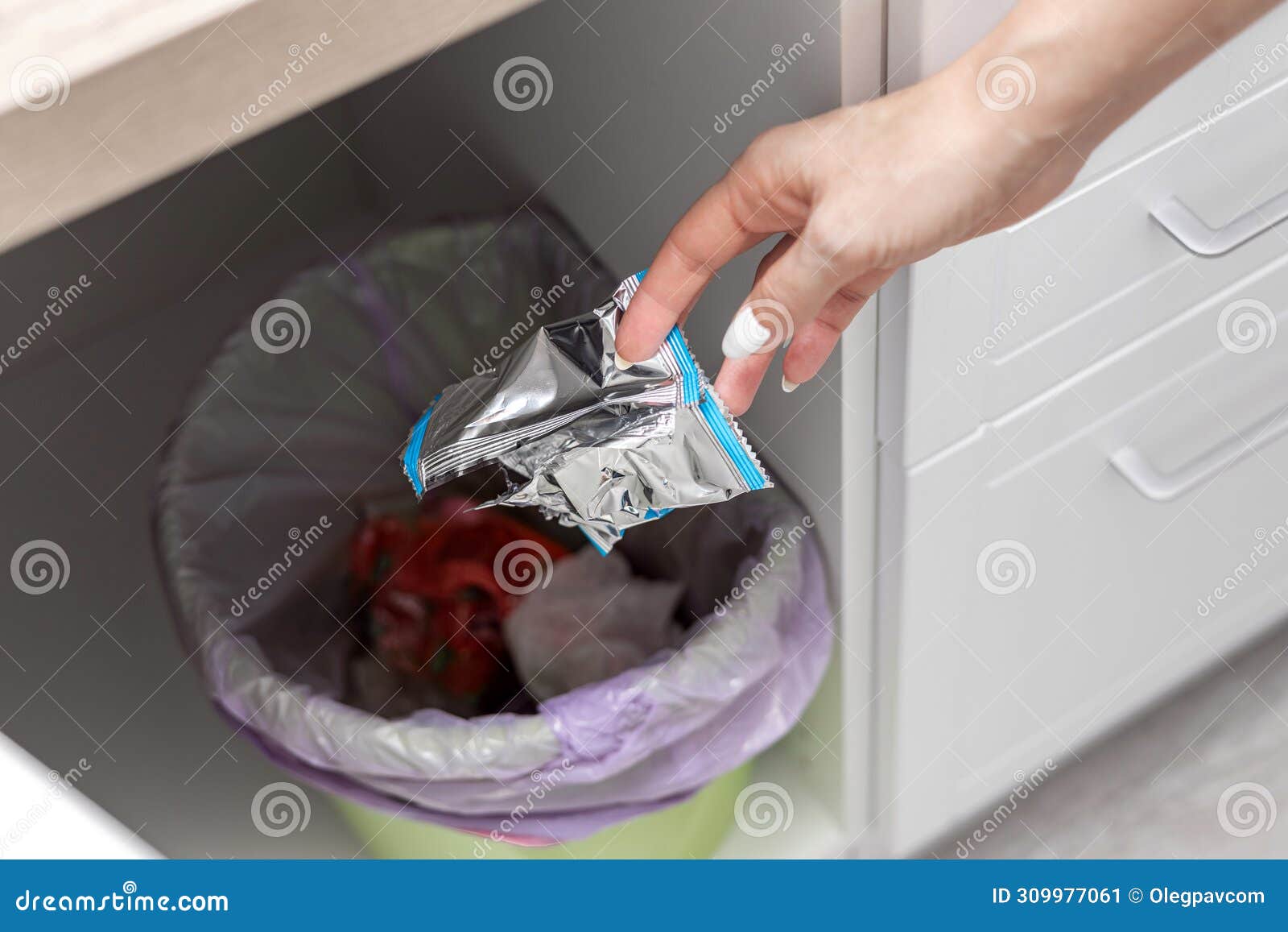 Man Throwing Plastic Packaging into Trash Bin at Home. Stock Image ...