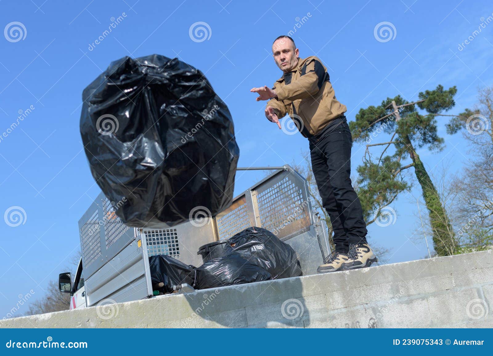 Man throwing refuse bag stock image. Image of tree, dump - 239075343