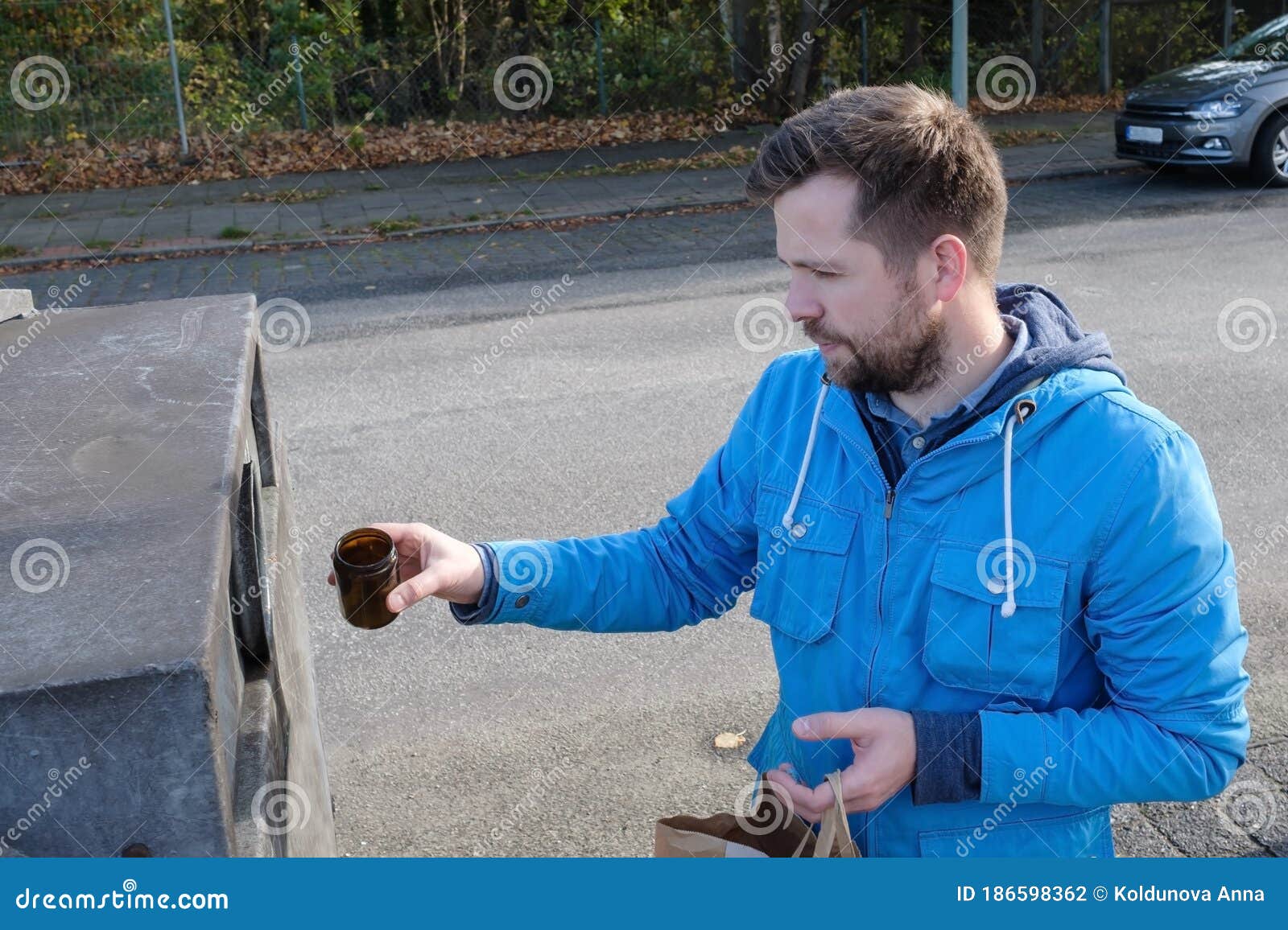 Man Throwing Sorted Garbage in the Street. Stock Photo - Image of ...