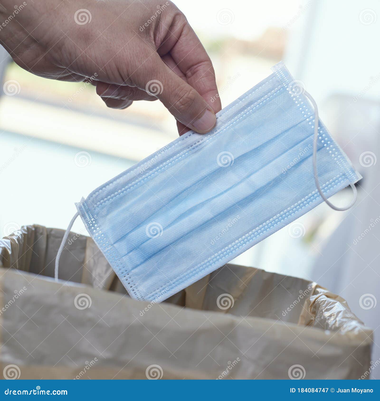 Man Throwing a Surgical Mask To the Trash Can Stock Image - Image of ...