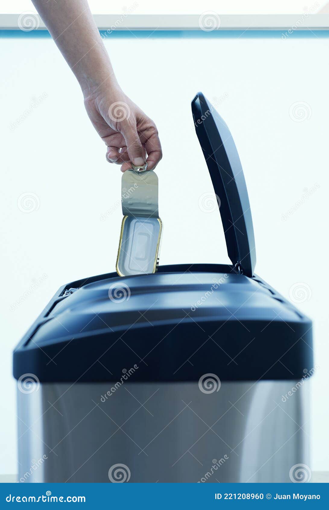 Man Throwing a Tin Can in a Home Recycling Bin Stock Photo - Image of ...
