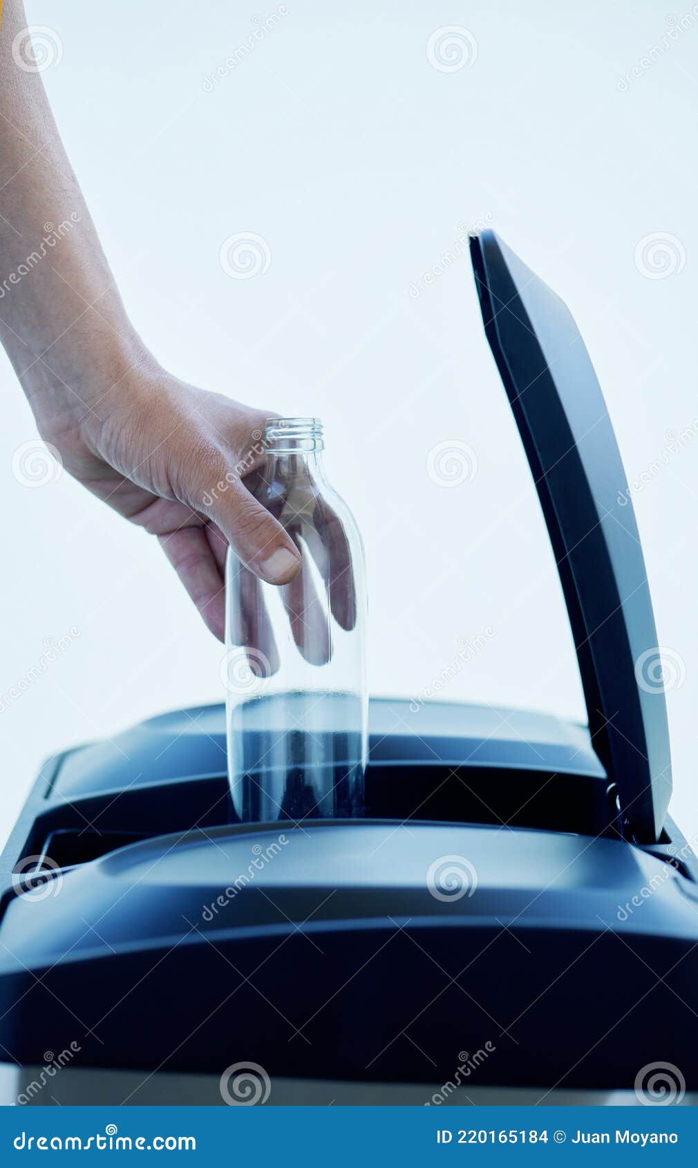 Man Throws a Glass Bottle in a Home Recycling Bin Stock Photo - Image ...