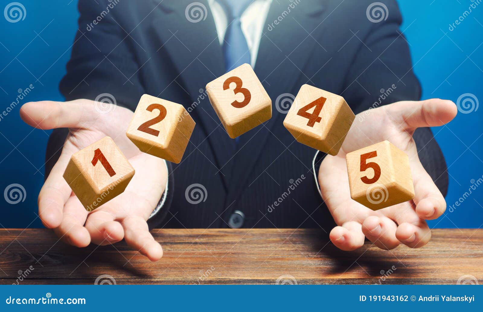Man Throws 5 Numbered Blocks with the Numbers One Two Three Four Five ... Man Throws 5 Numbered Blocks with the Numbers One Two Three Four Five ...