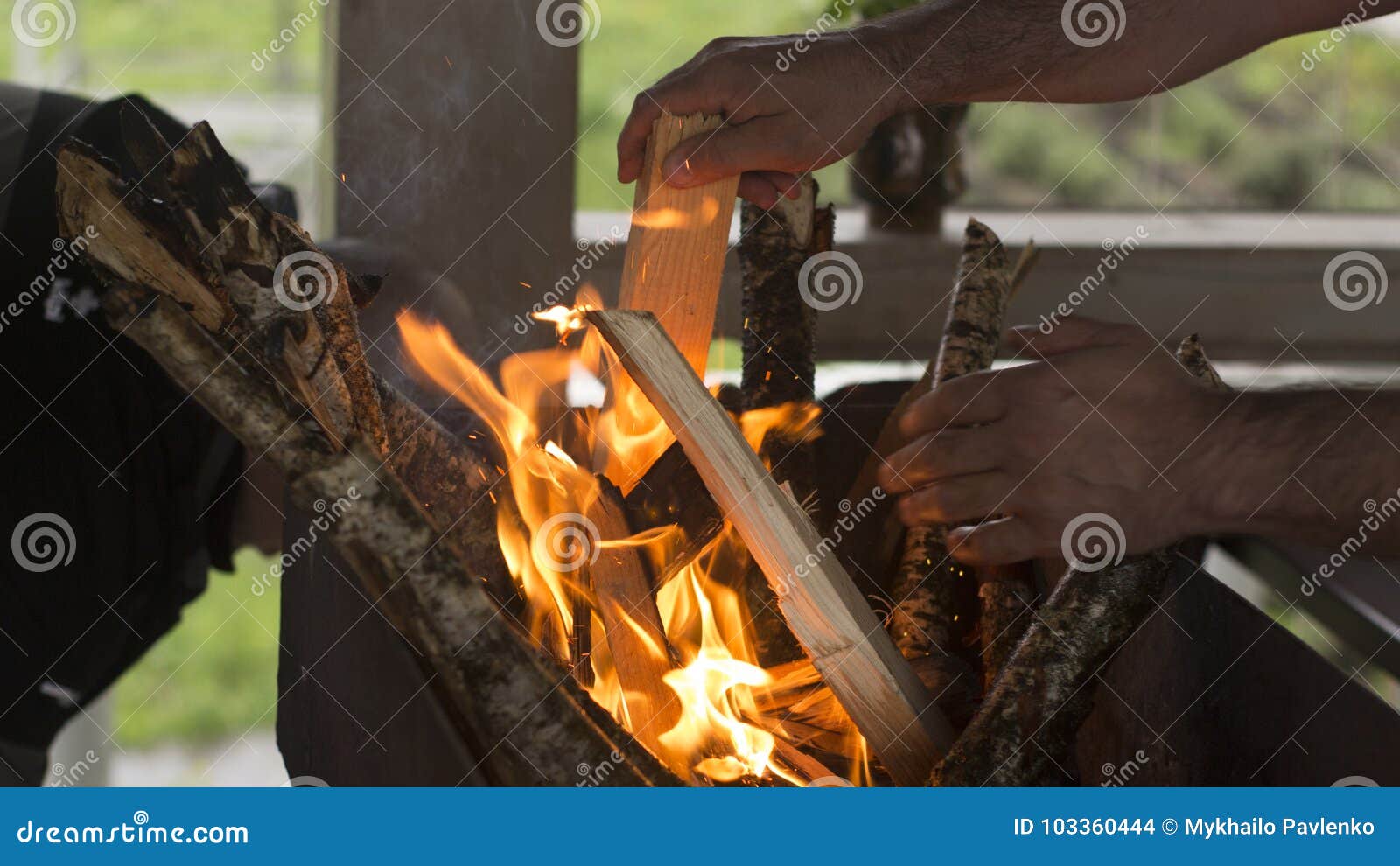 A Man Throws a Tree into the Fire Stock Photo - Image of anvil, bonfire ...