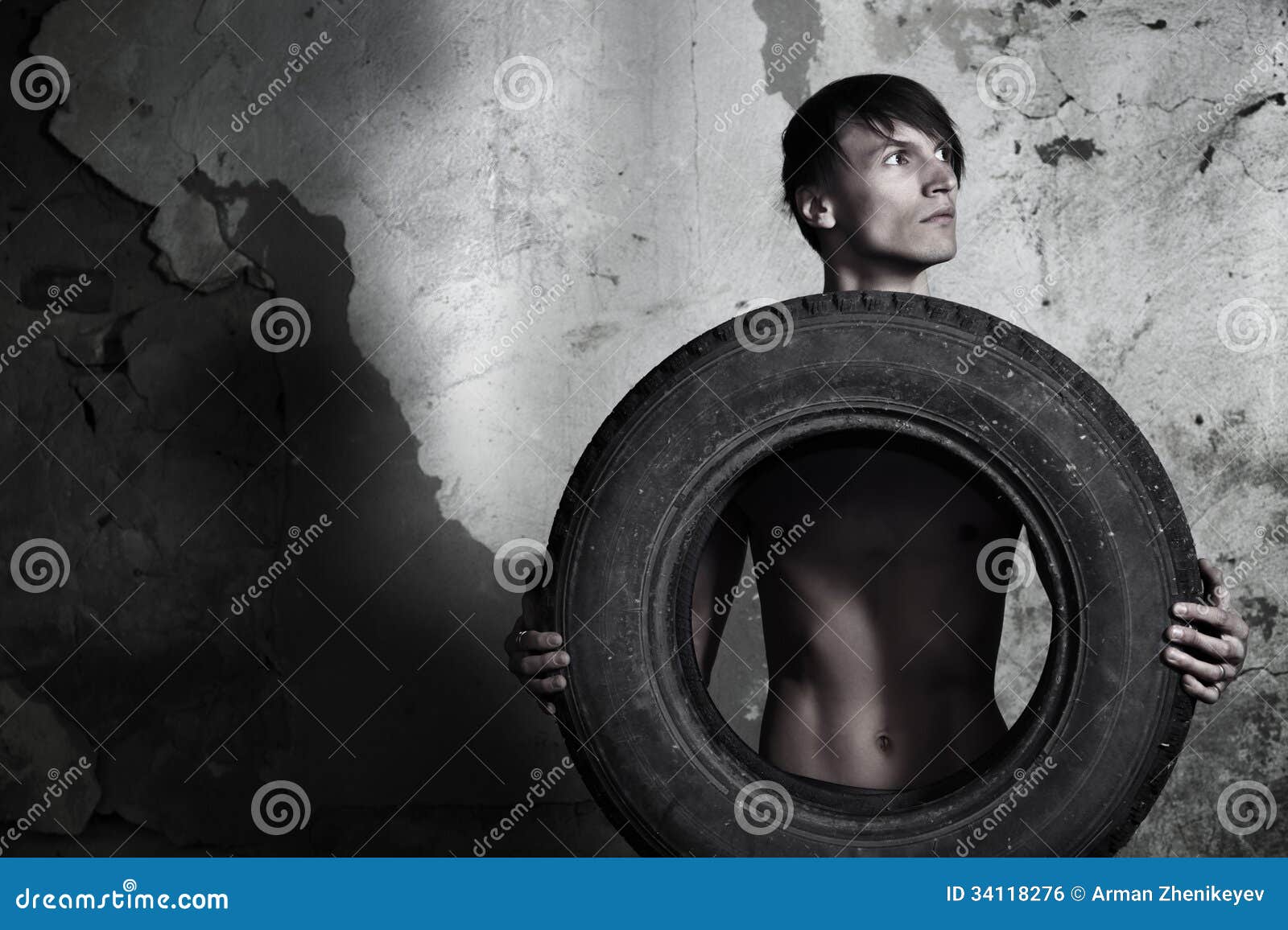 Man with tire stock photo. Image of curing, darkness - 34118276