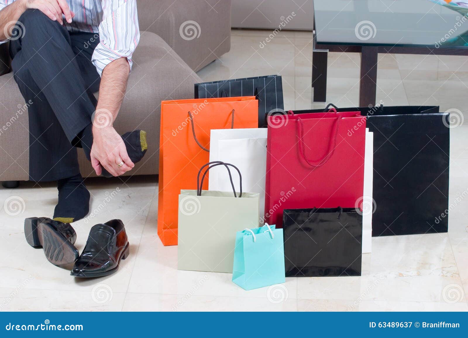 Man tired after shopping stock image. Image of sofa, sitting - 63489637