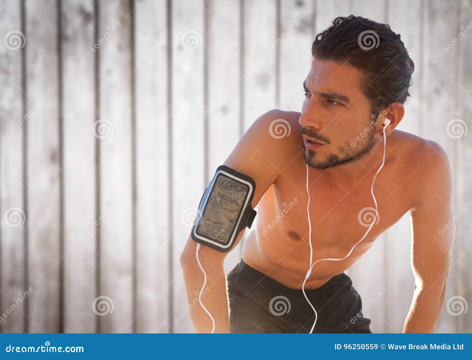 Man Tired from Training Against Blurry Grey Wood Panel Stock Image ...