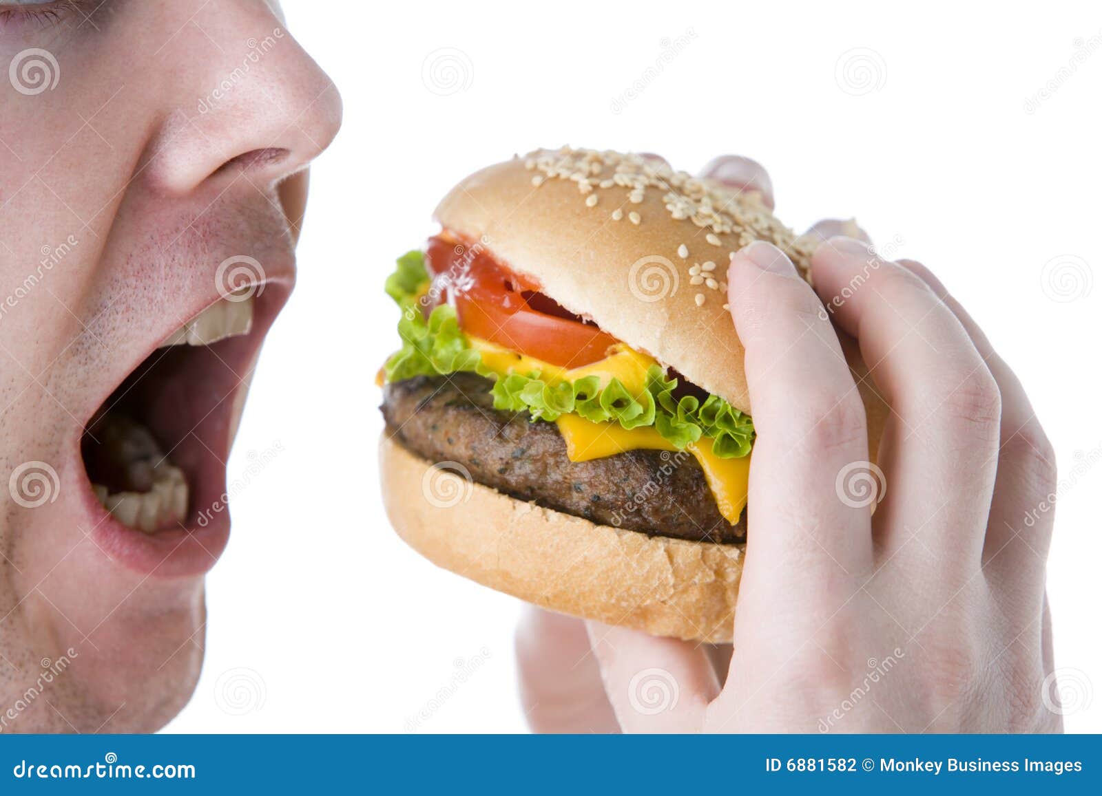Man about To Bite into a Cheeseburger Stock Photo - Image of hamburger ...