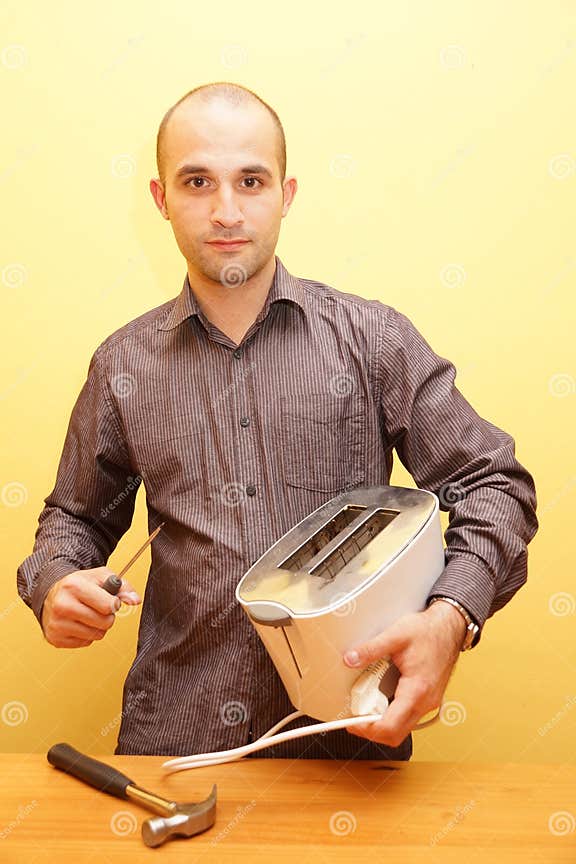 Man with toaster stock photo. Image of repairing, wooden - 24734658