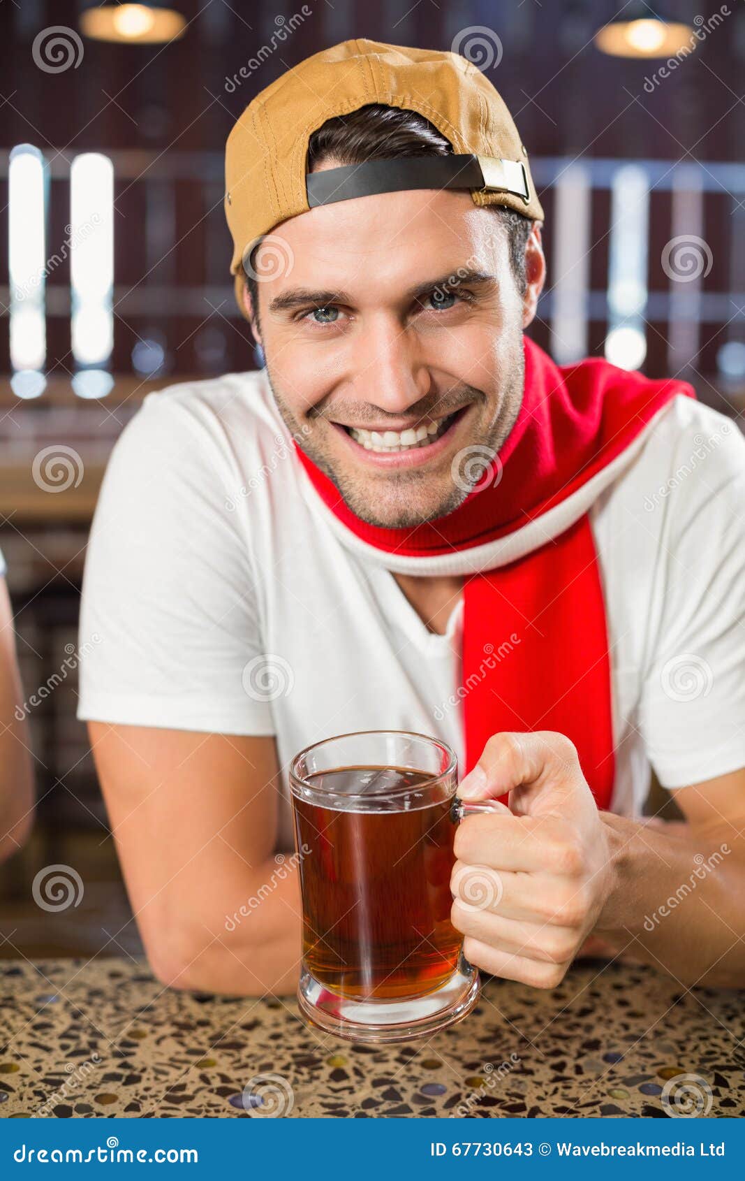 Man toasting a beer stock image. Image of holding, friend - 67730643
