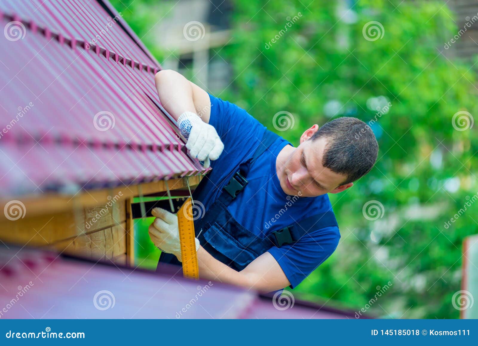 A Man with a Tool during the Repair of the Roof Stock Photo - Image of ...