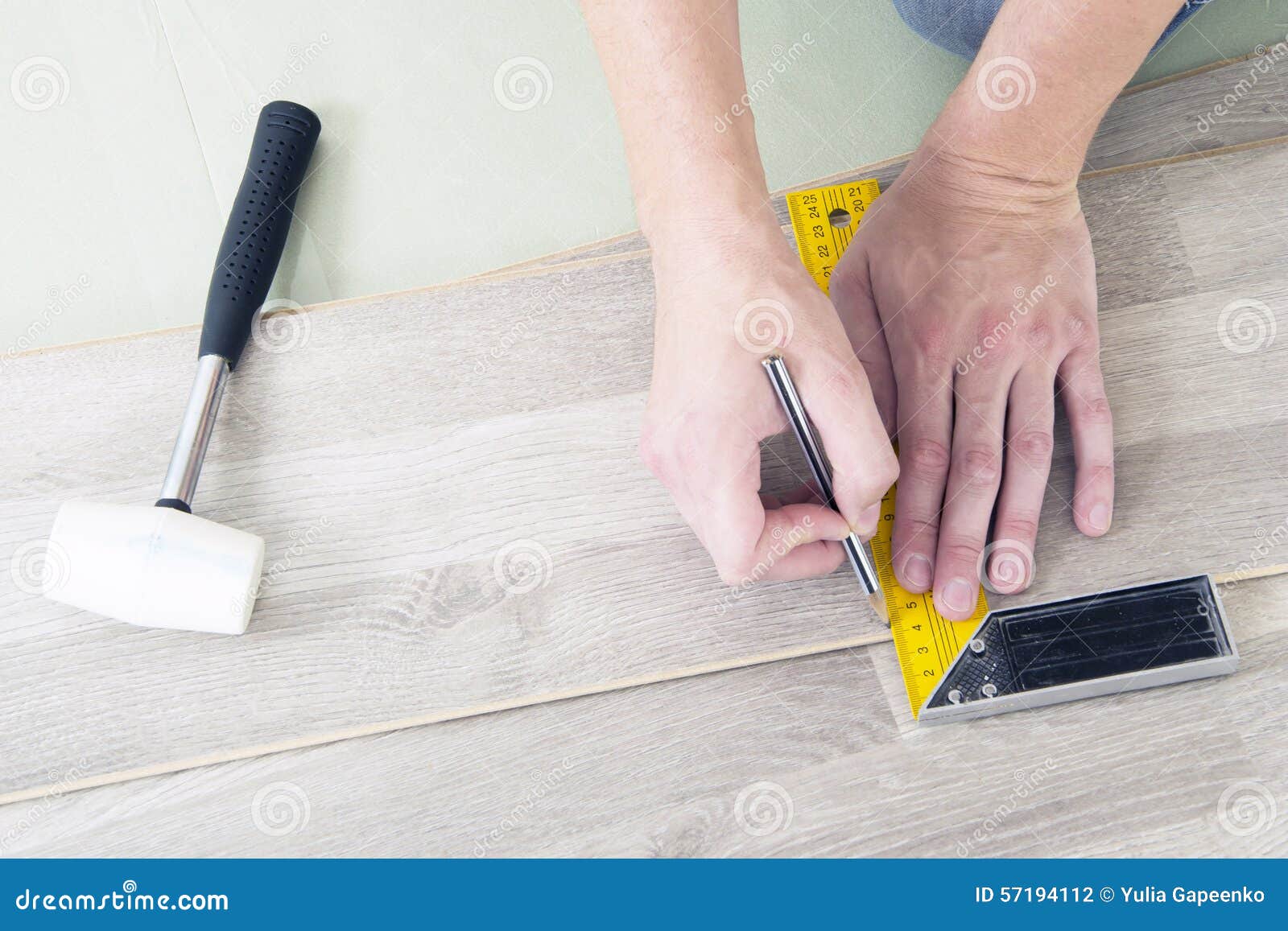 Man with Tools To Laying Laminate Stock Photo - Image of adjust ...