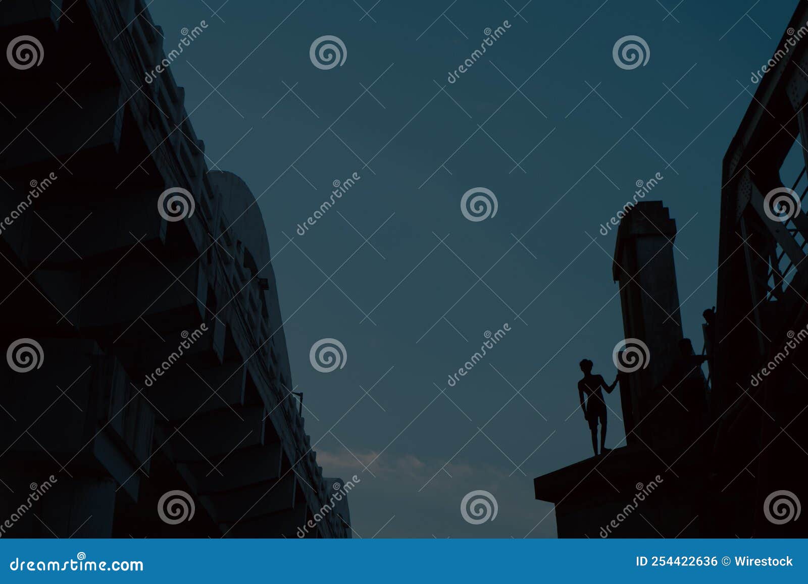 Man on Top of the Building during Night Time Stock Photo - Image of ...