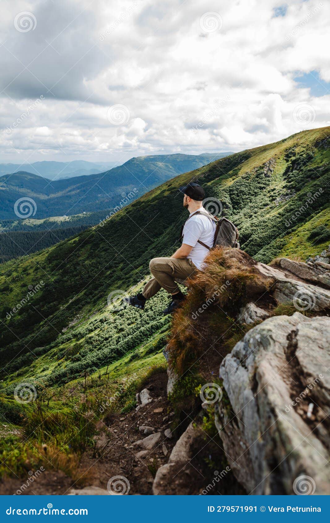 Man on Top of a Mountain Sitting on a Rock Stock Image - Image of ...