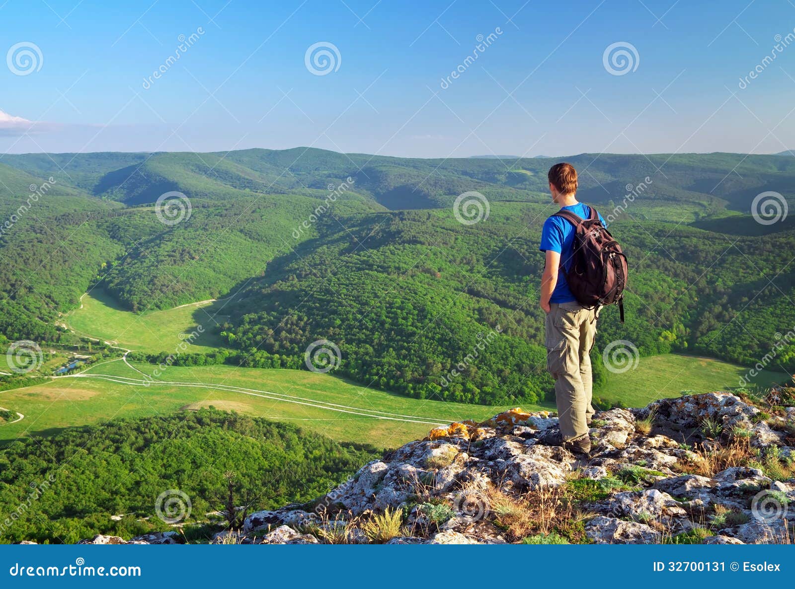 Man on top of mountain. stock image. Image of color, adventure - 32700131