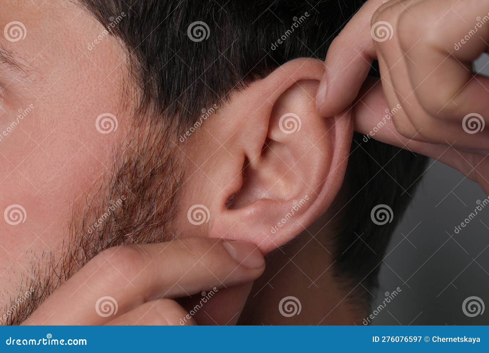 Man Touching His Ear on Grey Background, Closeup Stock Image - Image of ...