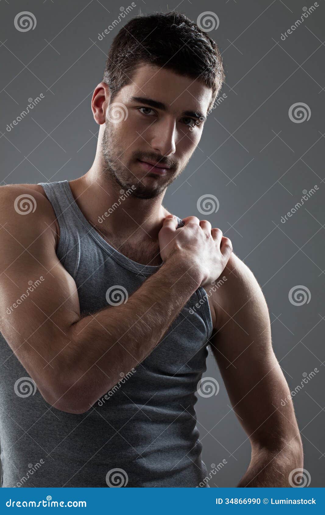Man Touching His Shoulder stock photo. Image of shoulder - 34866990