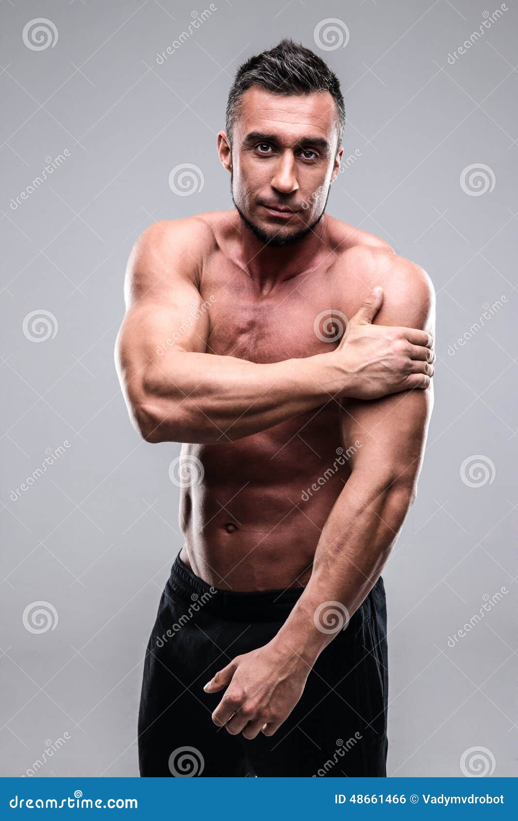 Man touching his shoulder stock photo. Image of people - 48661466