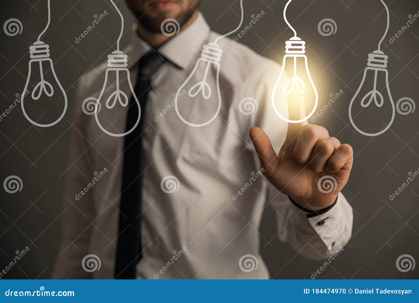 Man touching in light bulb stock photo. Image of symbol - 184474970