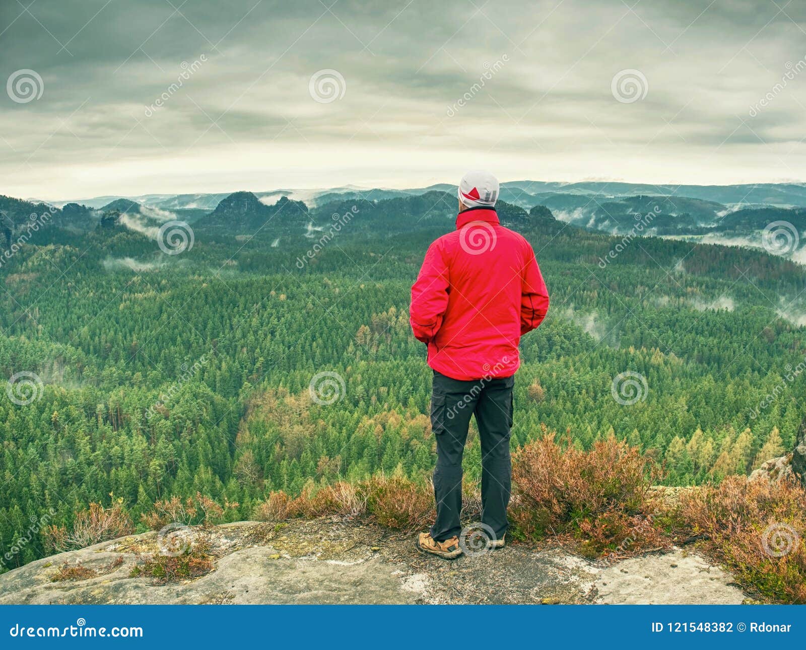 Hiker in Red Jacket Climbed Up To Peak Enjoy View. Mountain Climber ... Hiker in Red Jacket Climbed Up To Peak Enjoy View. Mountain Climber ...