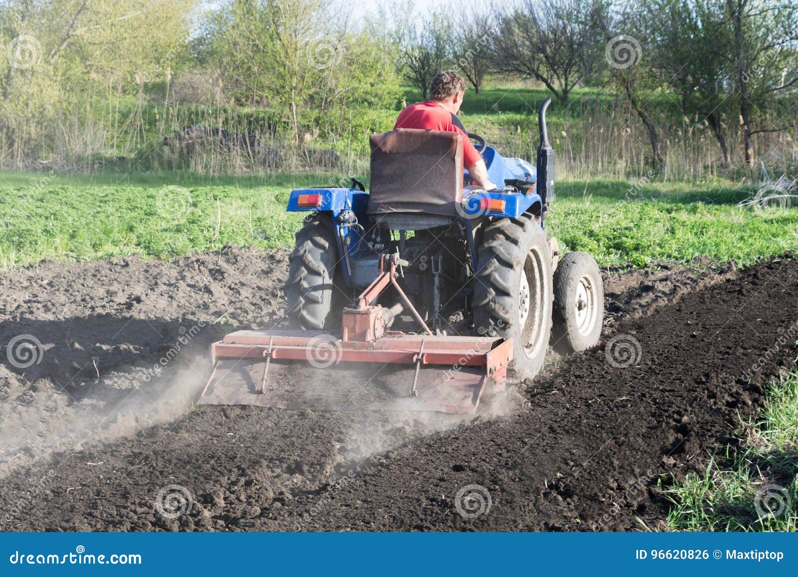Man on the Tractor, Back View Stock Photo - Image of agronomy, harrow ...