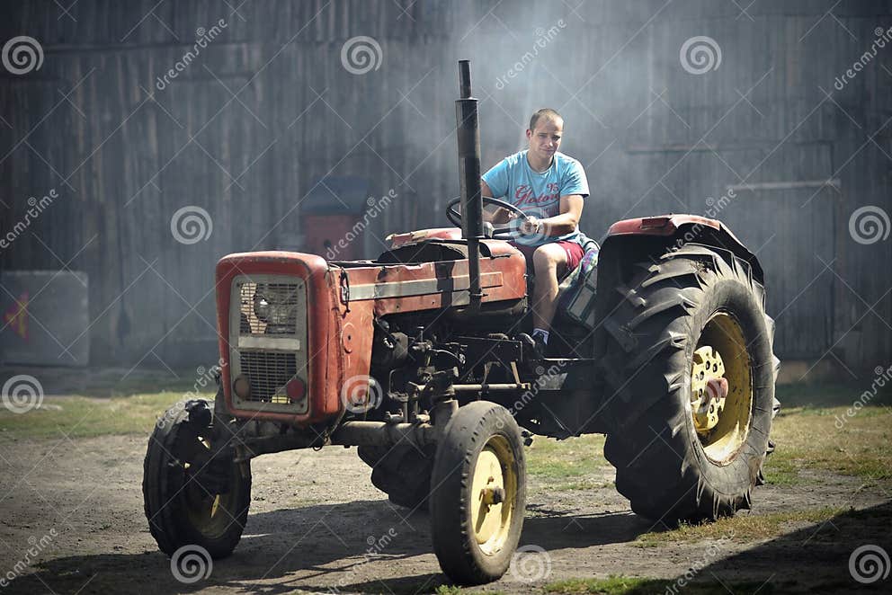 Man in tractor stock image. Image of backyard, agriculture - 48352265