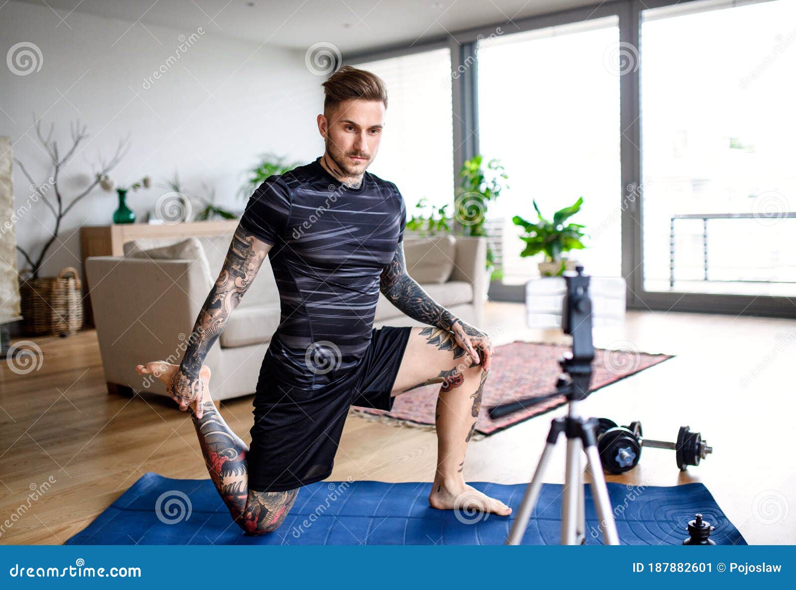 Man Trainer Doing Online Workout Exercise Indoors at Home, Using Camera ...
