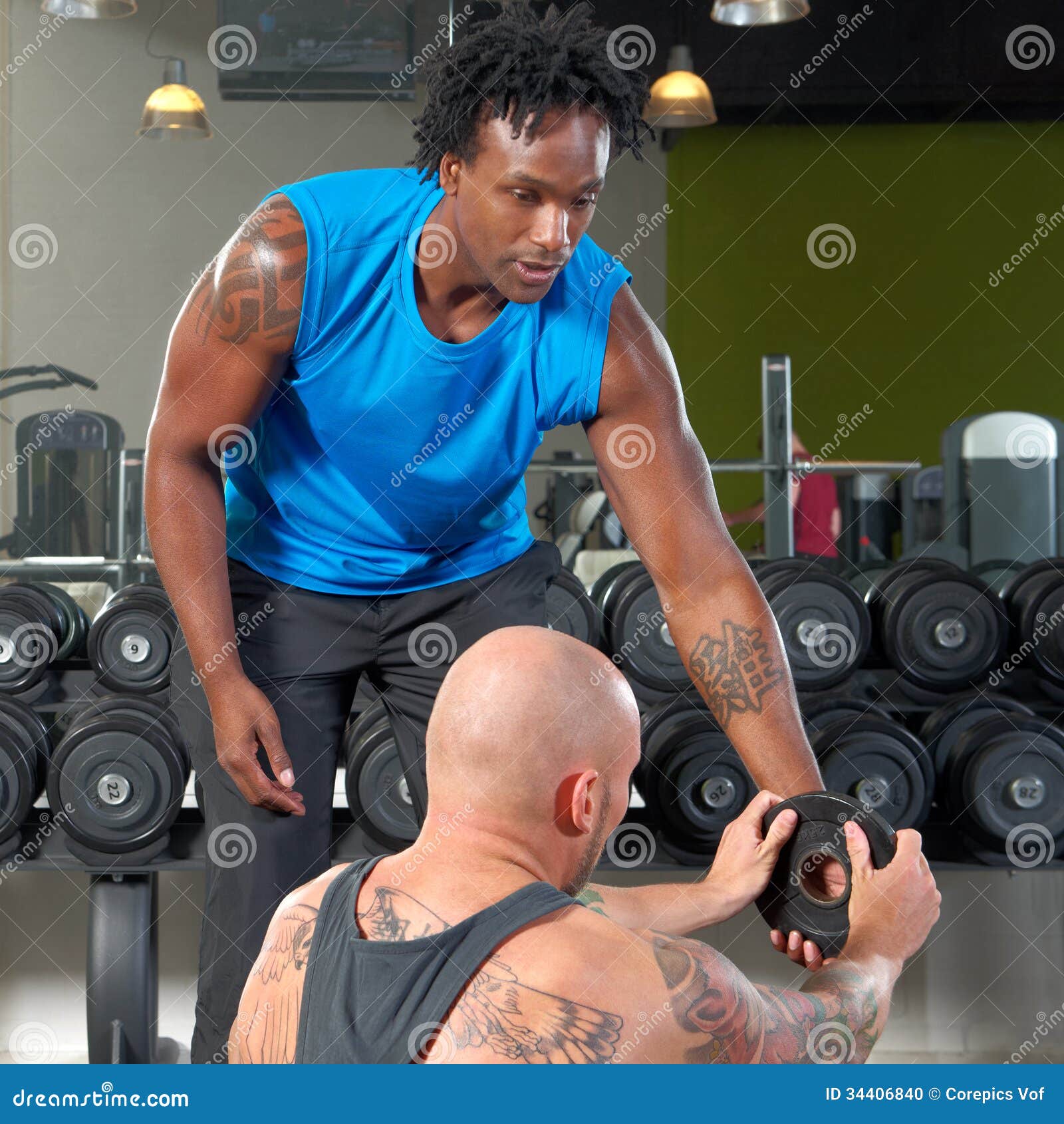 Man with trainer in gym stock photo. Image of practicing - 34406840