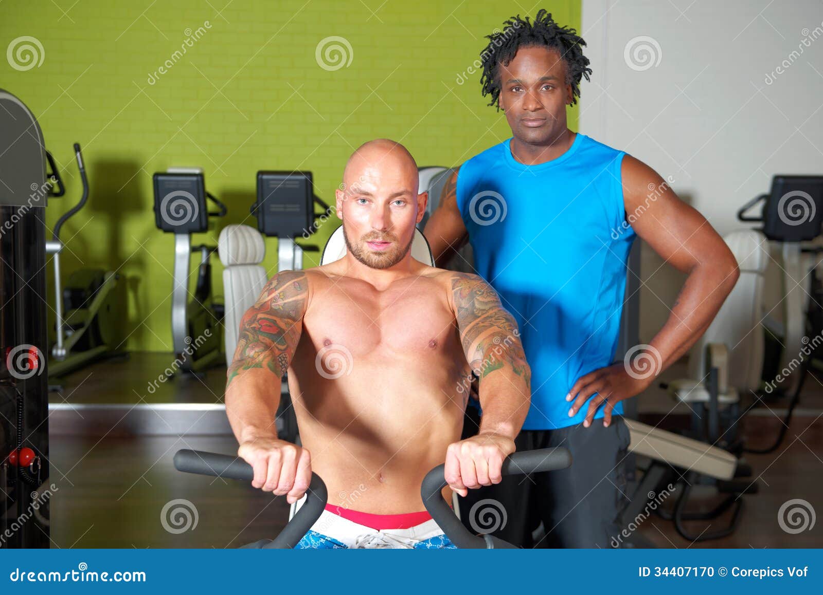 Man with trainer in gym stock photo. Image of sports - 34407170