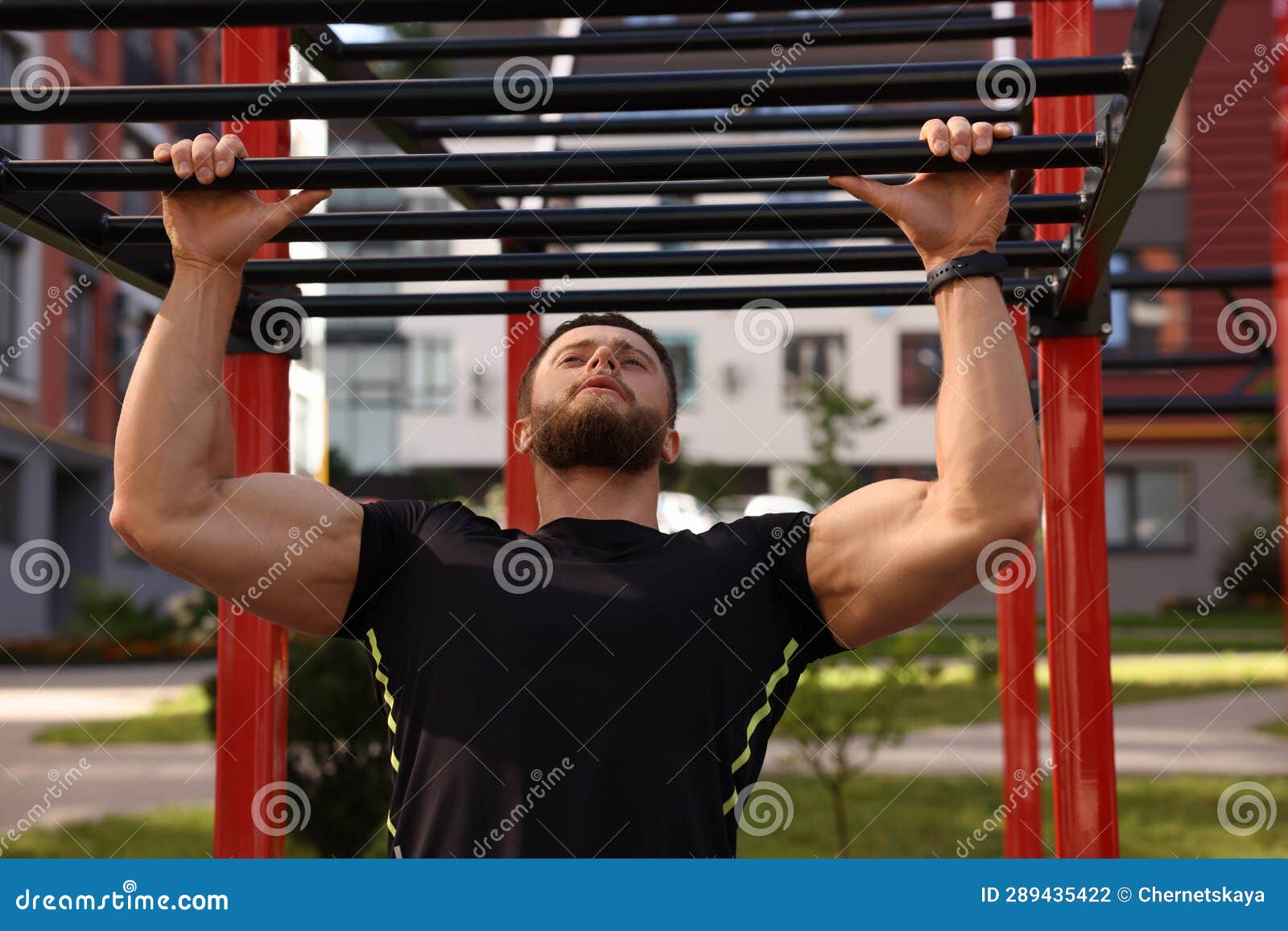 Young Man Training on Monkey Bars at Outdoor Gym Stock Photo - Image of ...