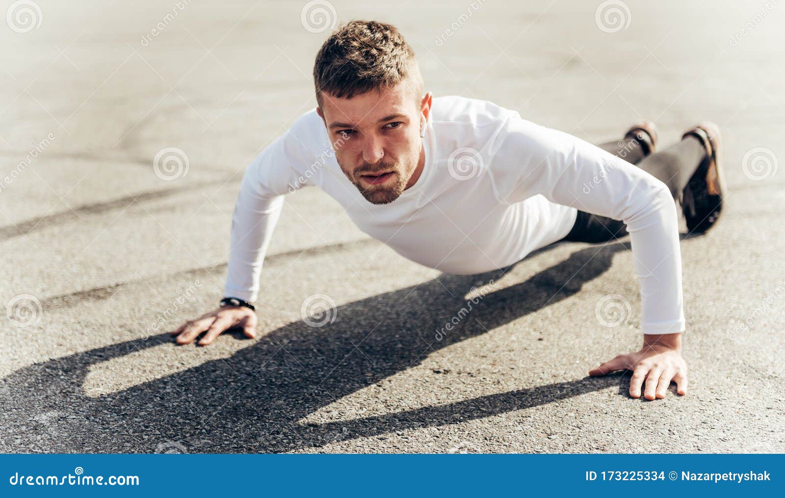 Man Training Push Up Outdoors. Handsome Man Doing Push-ups Outdoors ...