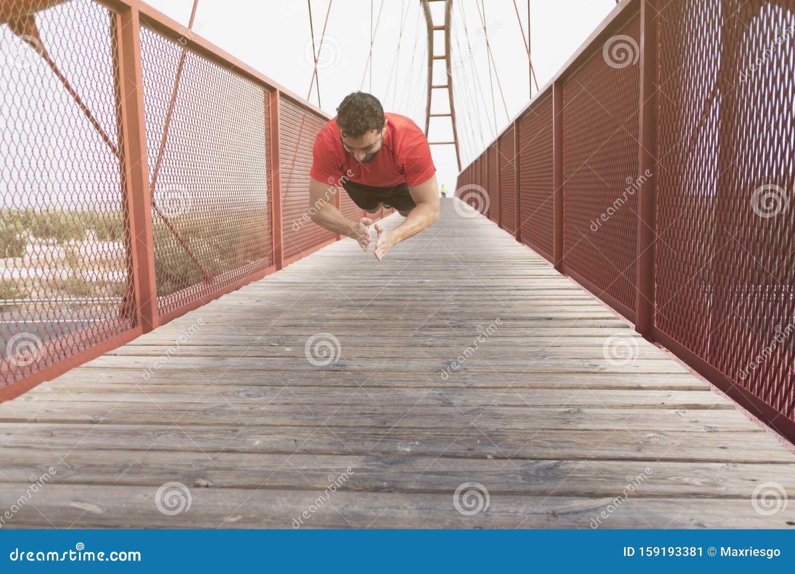 Man Training Push Ups on a Bridge Stock Image - Image of flooring ...