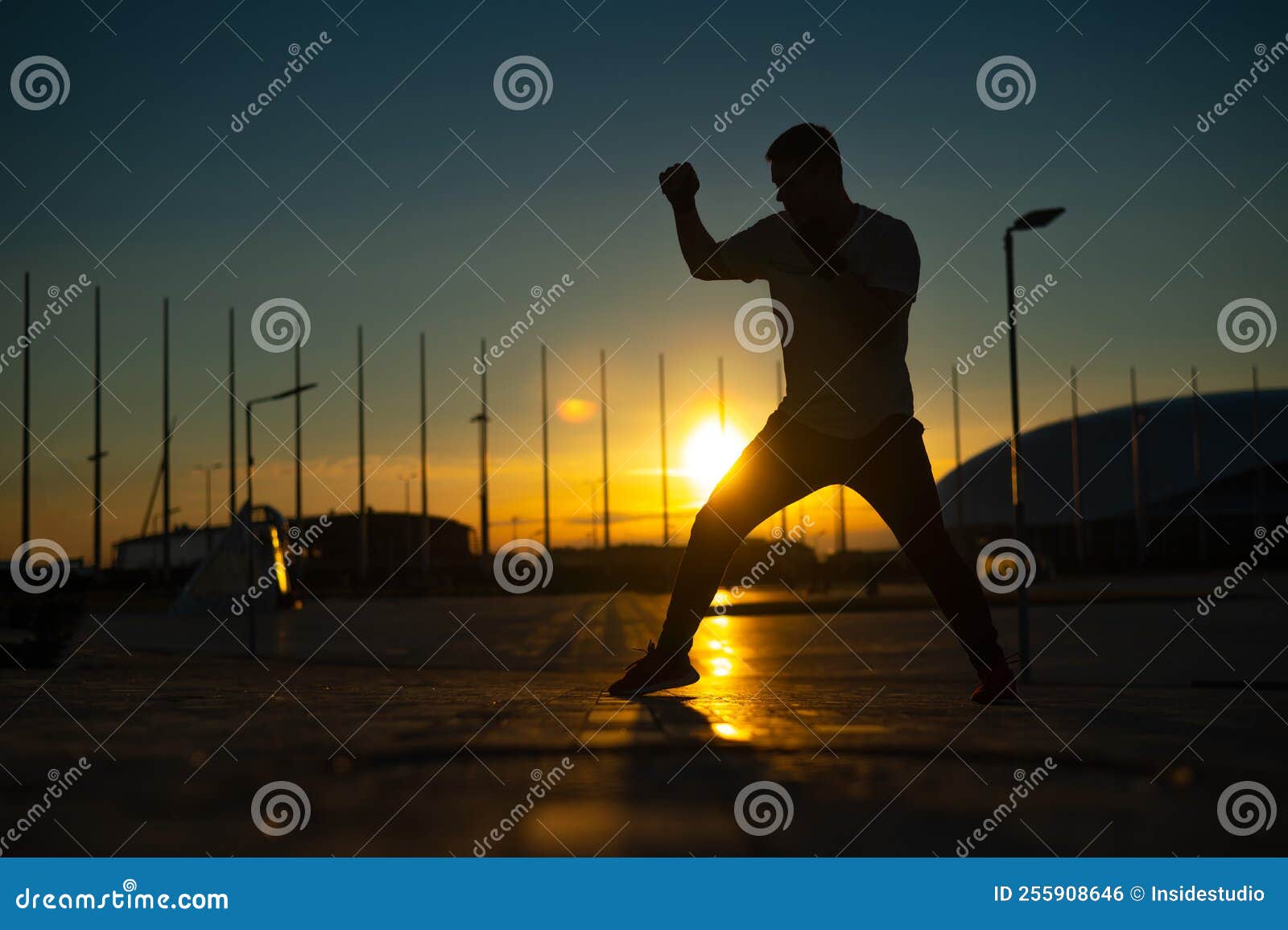 A Man Trains Boxing at Sunset Outdoors. Stock Photo - Image of bandage ...