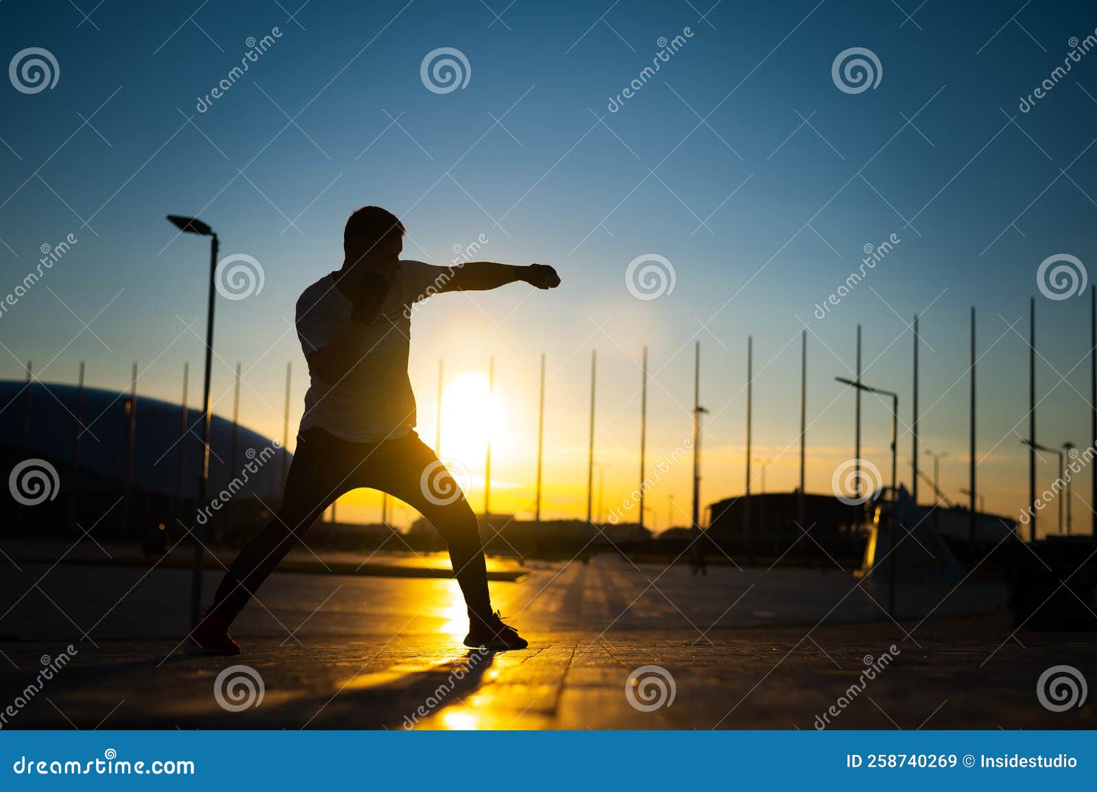 A Man Trains Boxing at Sunset Outdoors. Stock Image - Image of karate ...