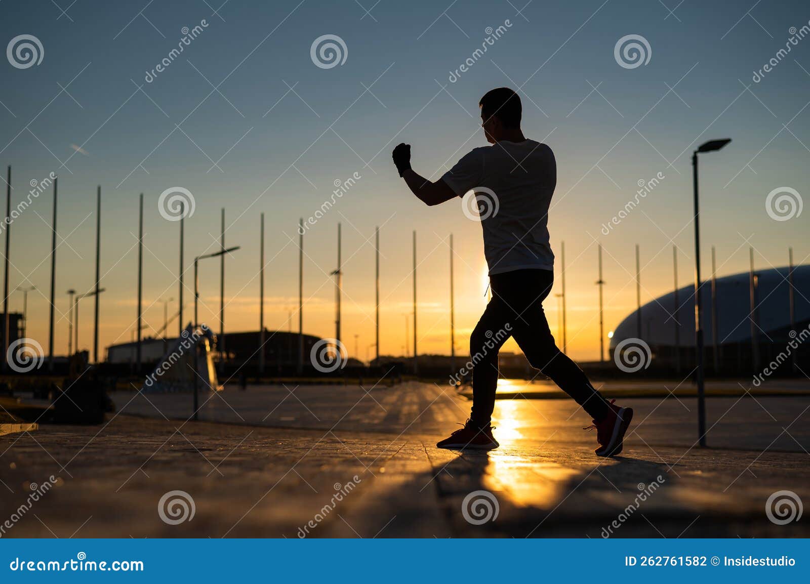 A Man Trains Boxing at Sunset Outdoors. Stock Photo - Image of ...