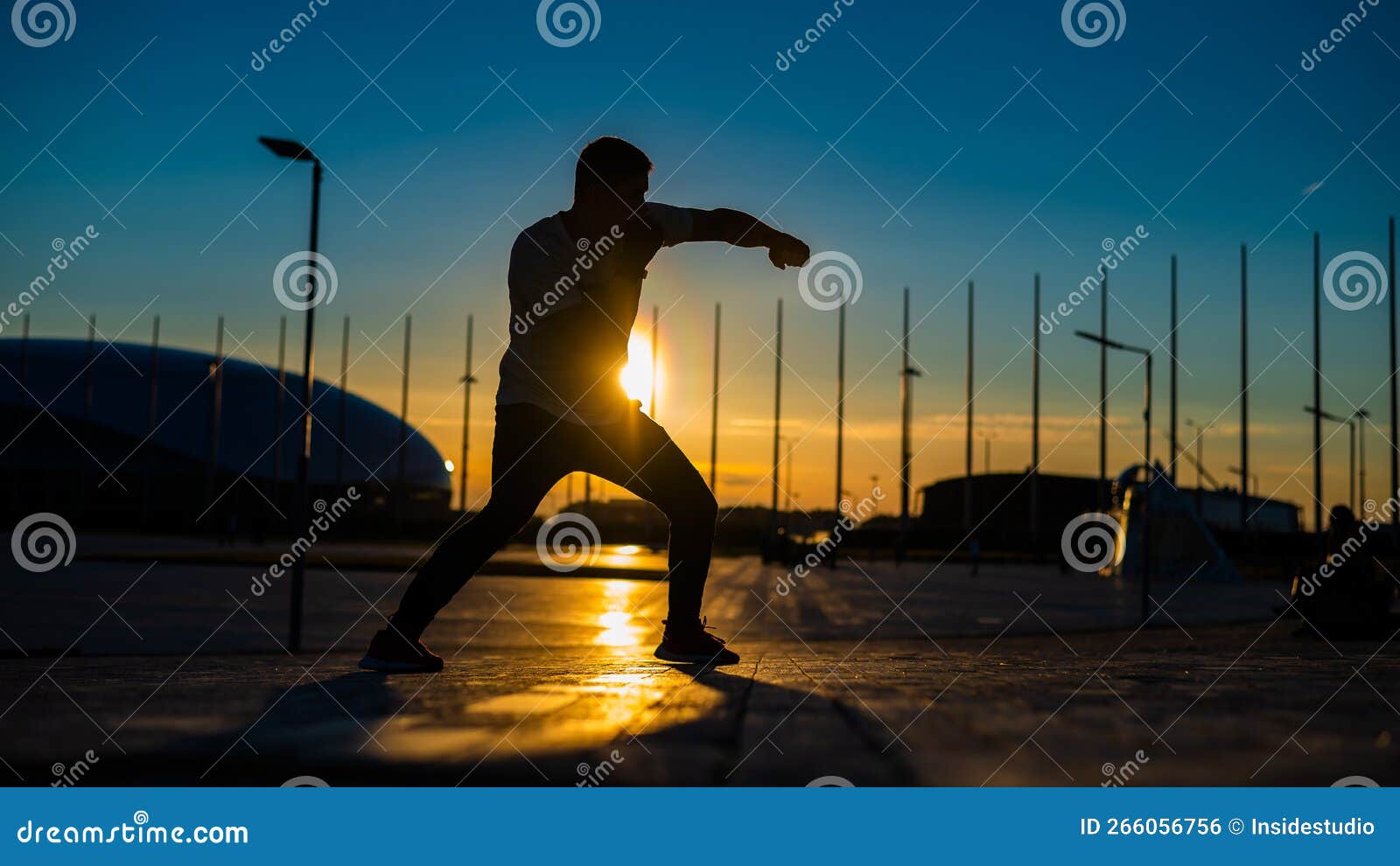 A Man Trains Boxing at Sunset Outdoors. Stock Photo - Image of intense ...