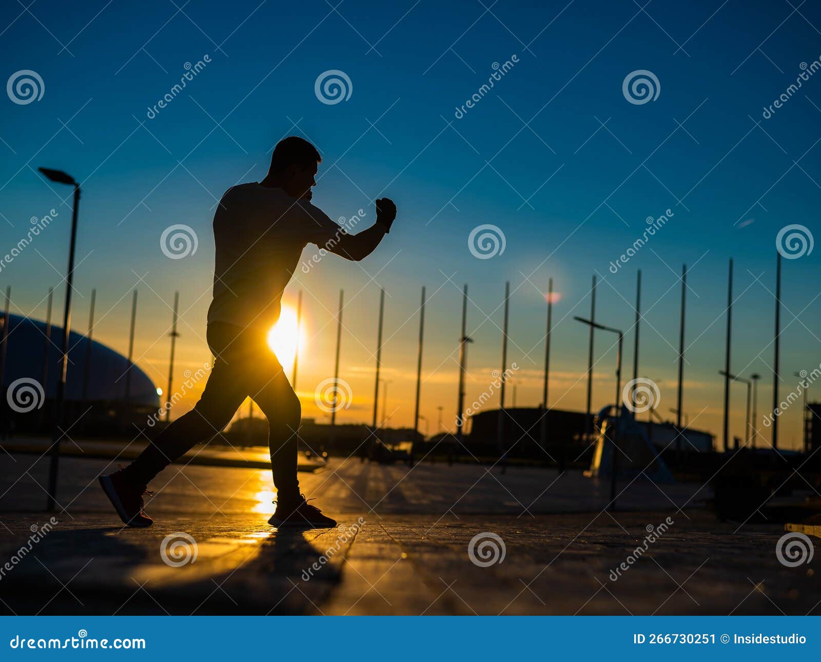 A Man Trains Boxing at Sunset Outdoors. Stock Image - Image of ...