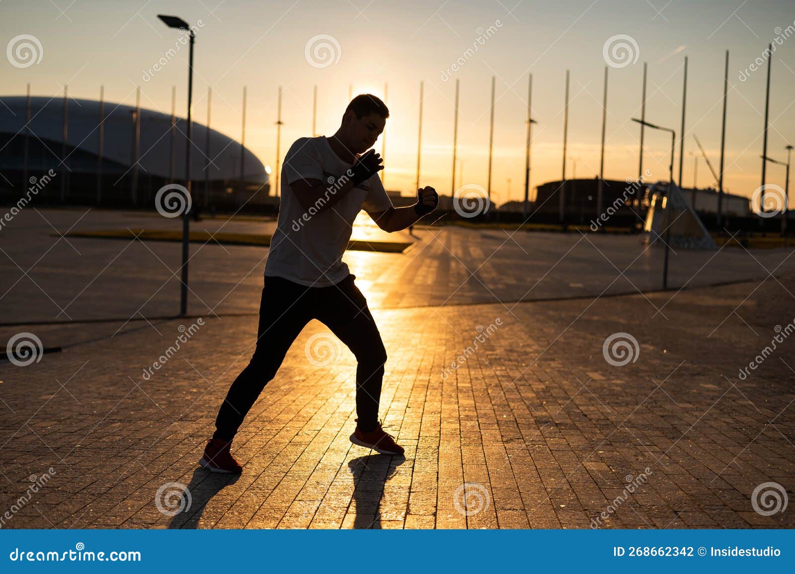 A Man Trains Boxing at Sunset Outdoors. Stock Photo - Image of ...