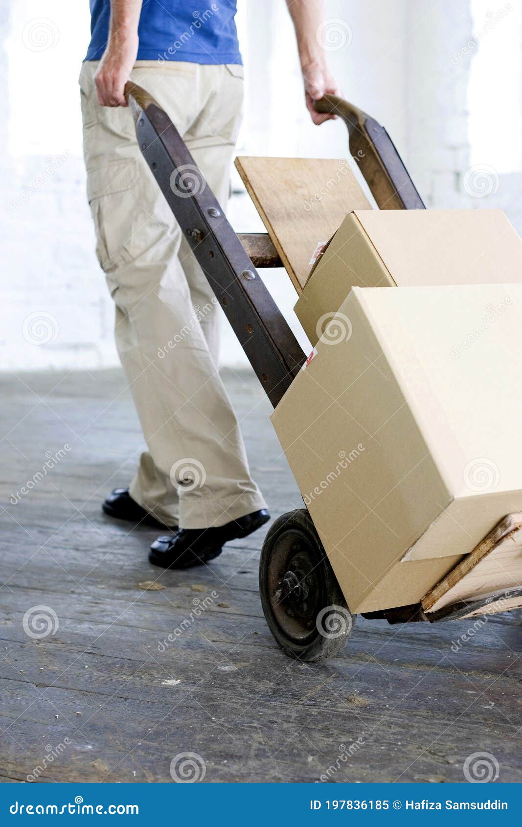 A Man Transferring Goods Using Trolley Stock Image - Image of collar ...