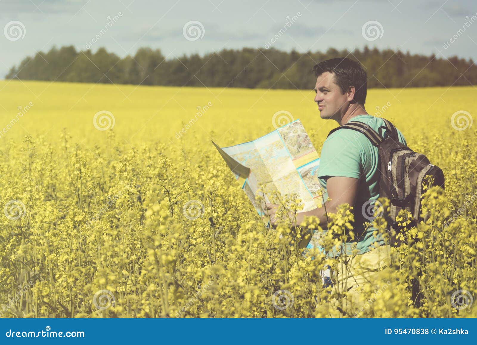 Man Traveler with Map in Hand Looking at it Against the Background of ...