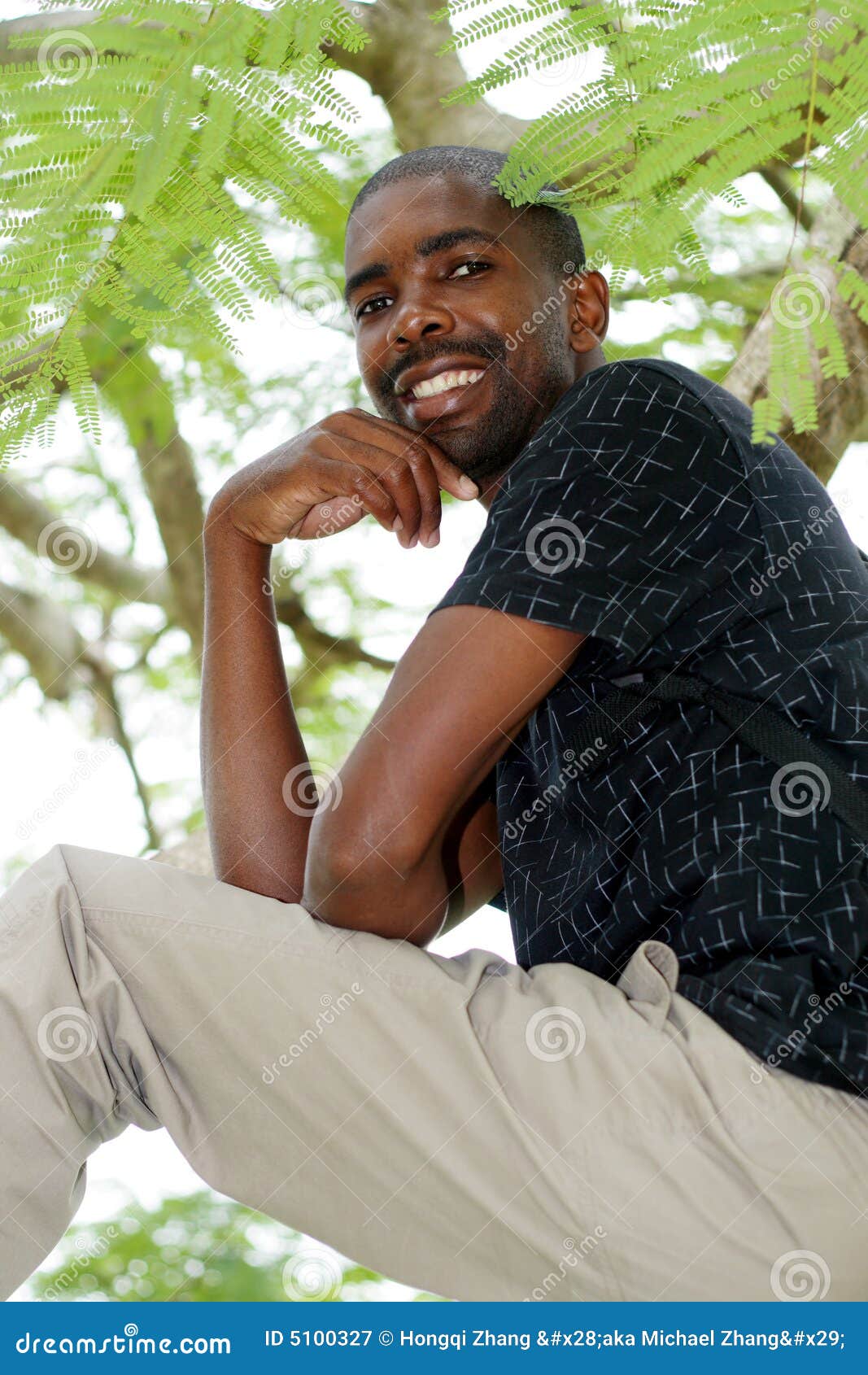 Man on tree stock image. Image of leisure, grass, activity - 5100327