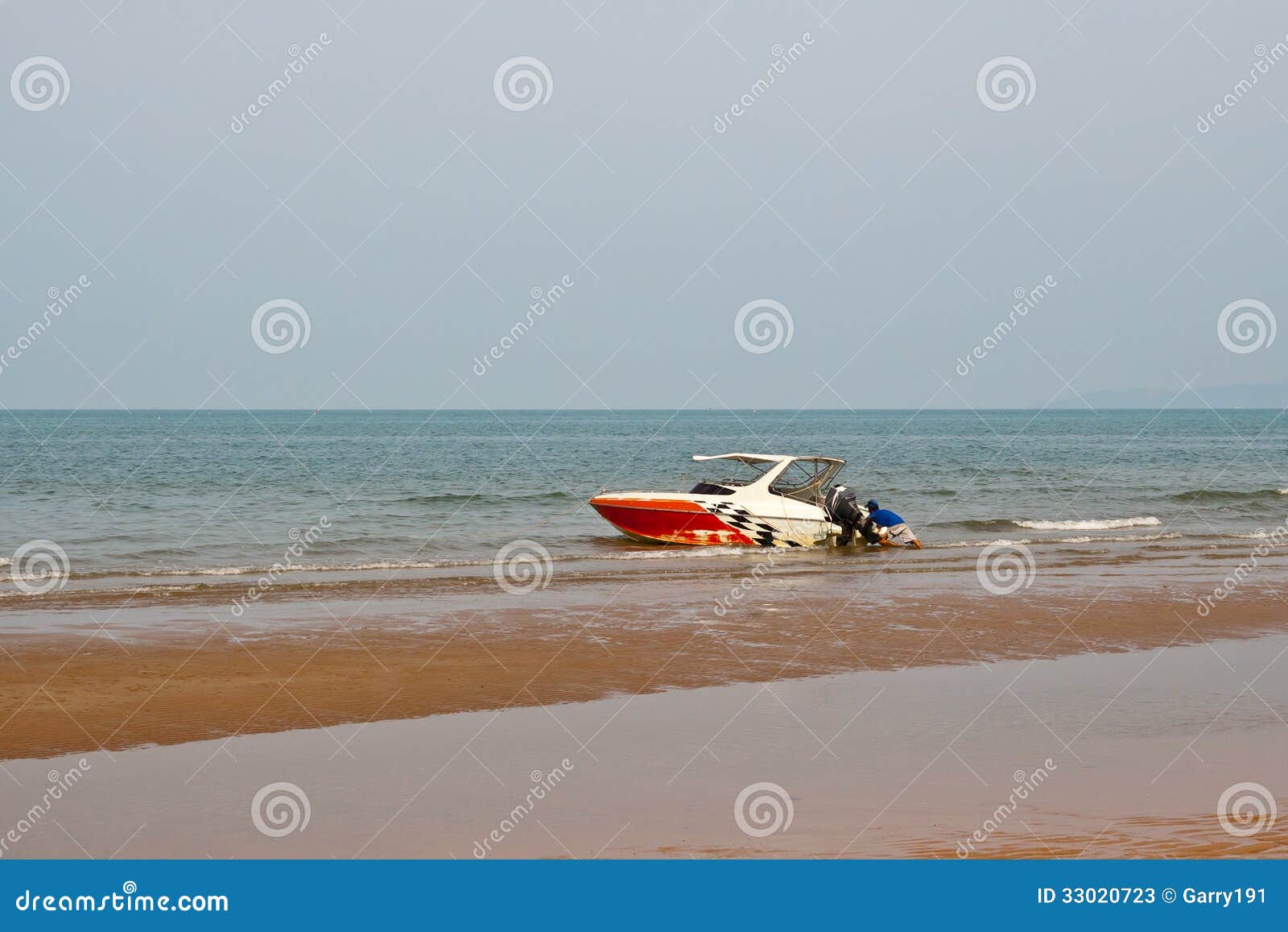 Man Tries To Push the Boat at Low Tide Stock Image - Image of sailor ...