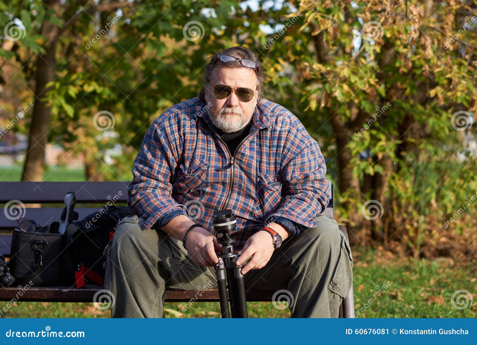 Man with tripod stock image. Image of photographer, orange - 60676081